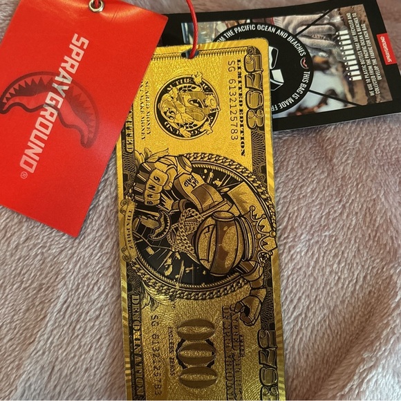 New York & Company | Media | Sprayground Gold Money Bookmark | Poshmark